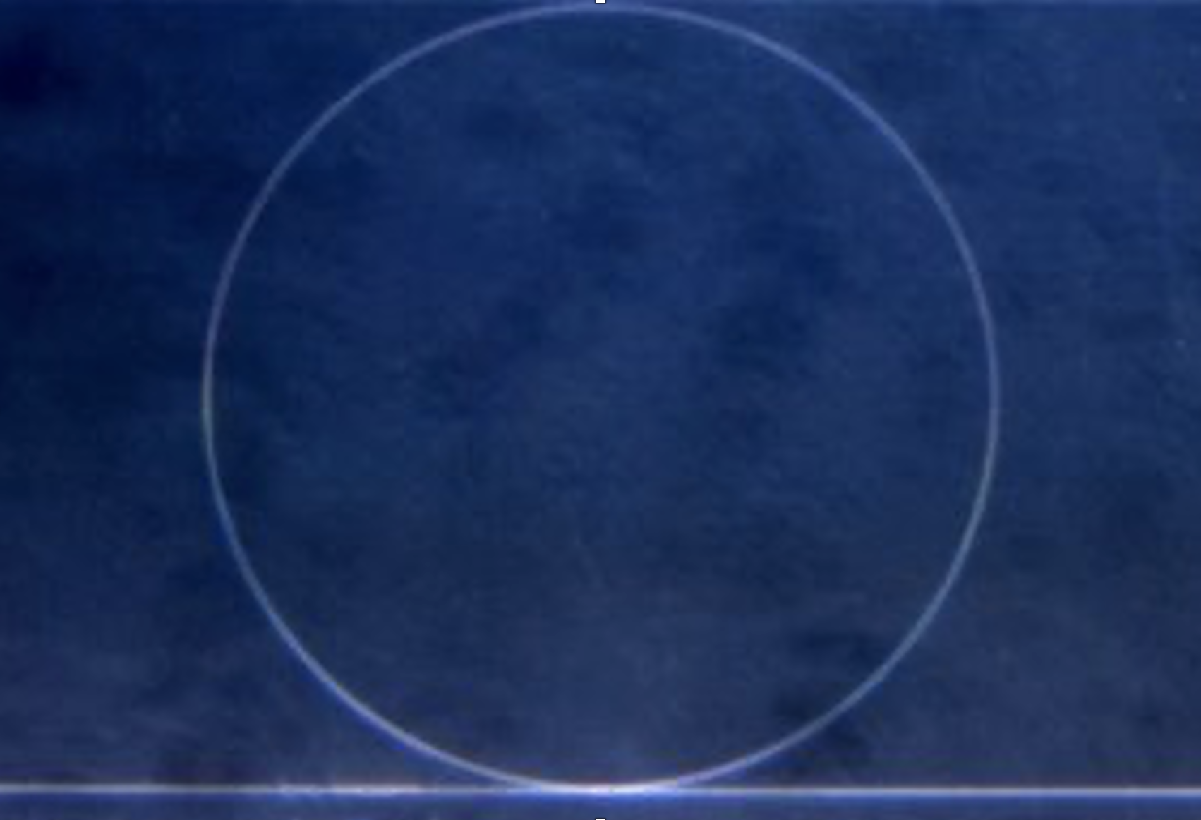 Optical microscope image of ring resonator (loss ~0.5 dB/m) fabricated using the ultralow-loss, low-confinement silicon nitride platform.